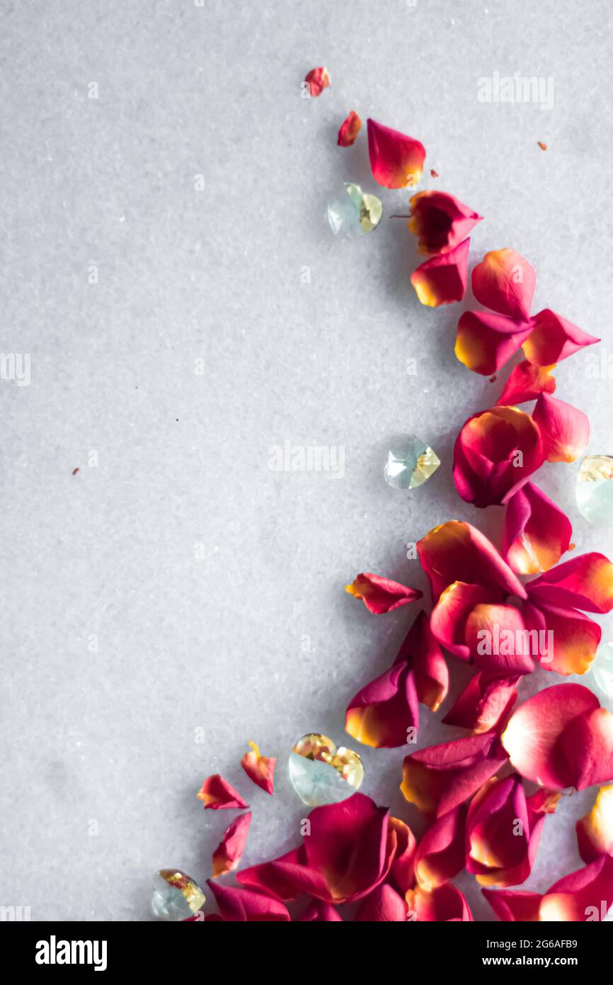 Rose petals on marble background, floral decor and wedding flatlay ...
