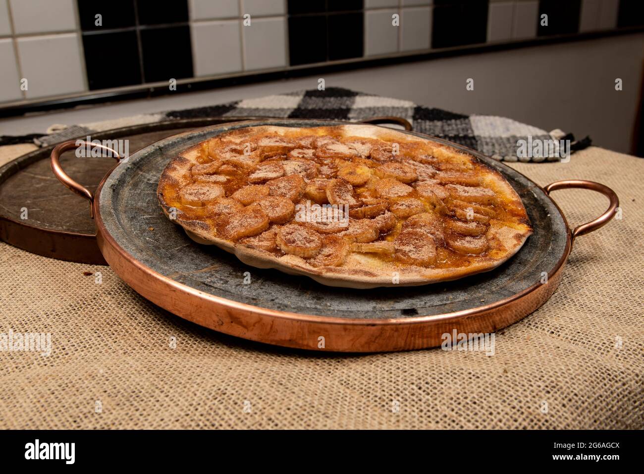 Sweet Brazilian pizza with banana, cinnamon and sugar, top view Stock ...