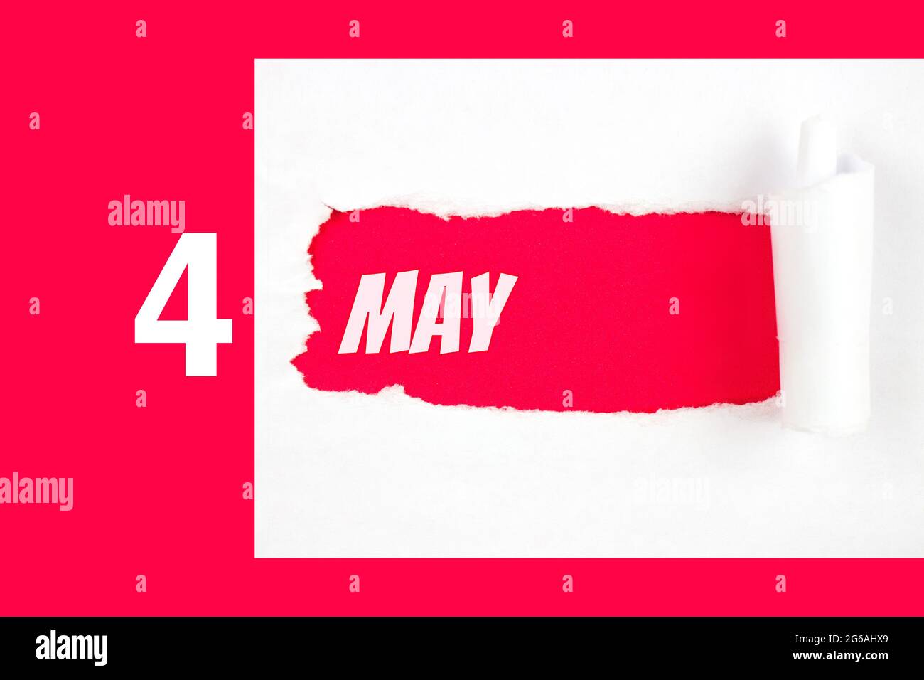 May 4th. Day 4 of month, Calendar date. Red Hole in the white paper ...