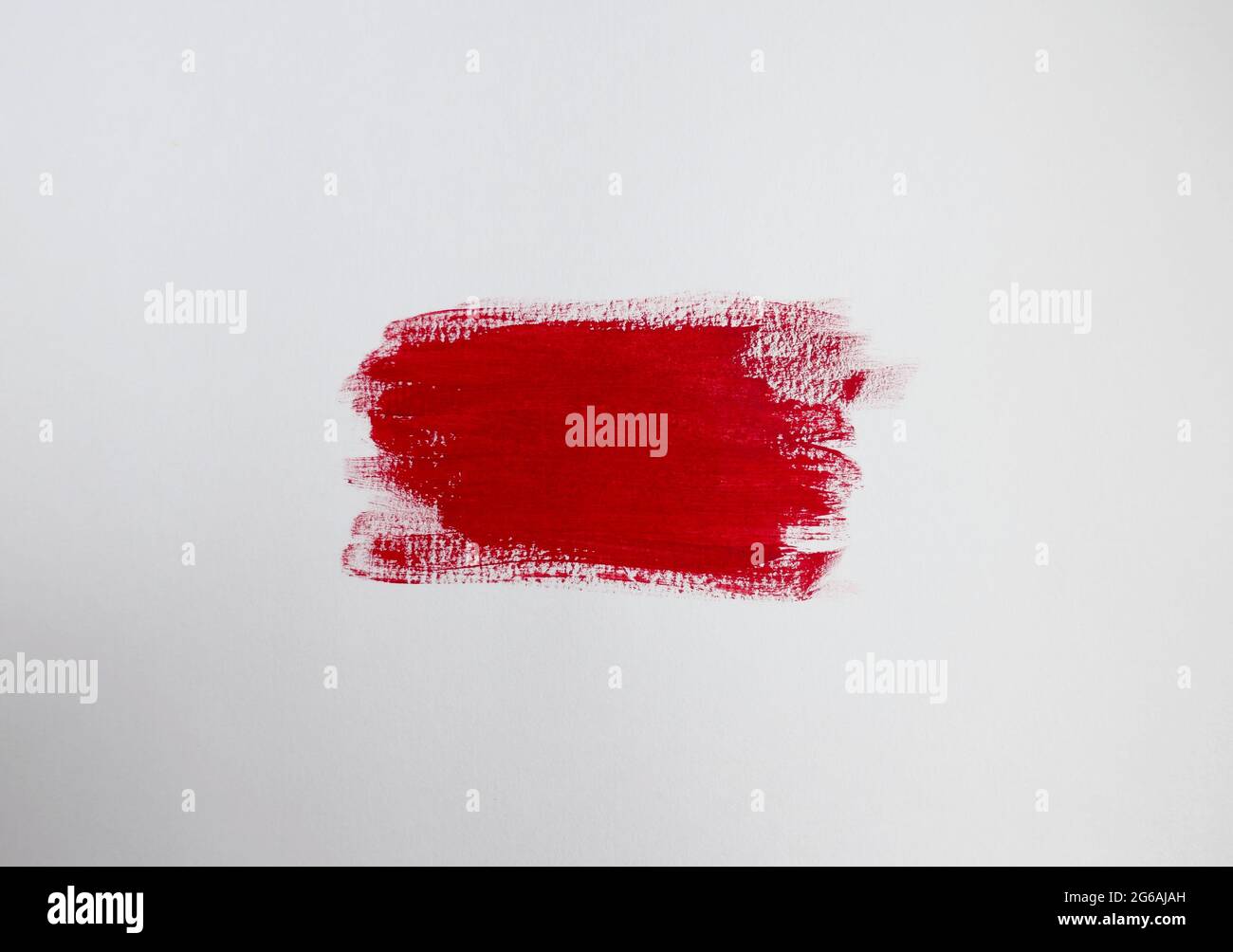 Crimson red paint patch on plain white background with copy space Stock ...