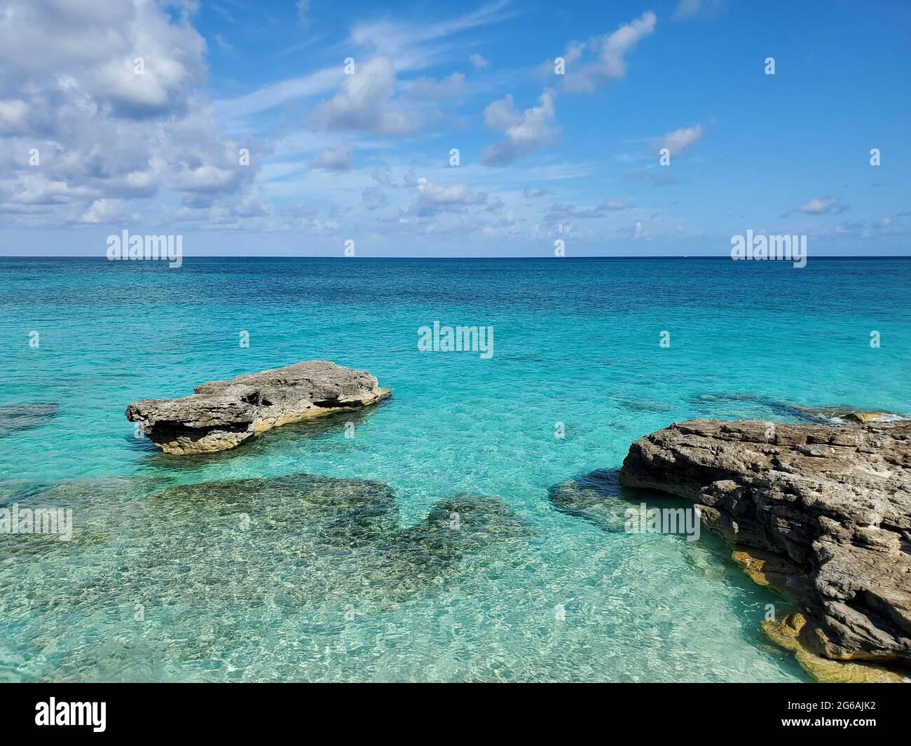 Crystal clear water amidst rocks and sandy beaches of North Bimini's ...