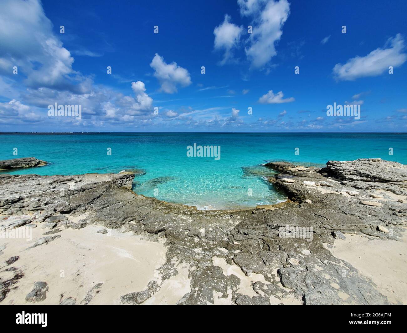 Crystal clear water amidst rocks and sandy beaches of North Bimini's ...