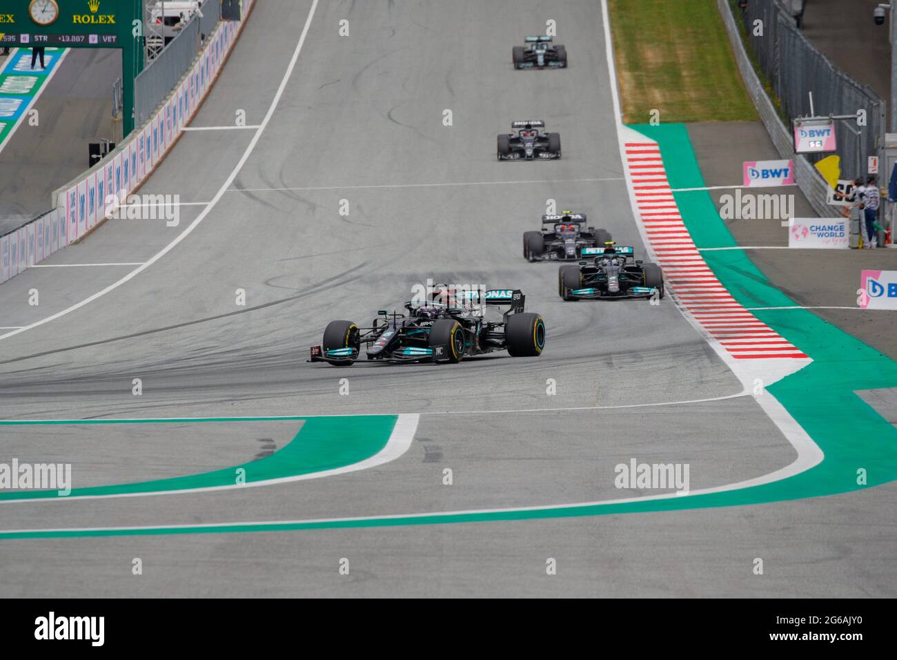 Lewis Hamilton driving Mercedes AMG into turn one at the start during ...