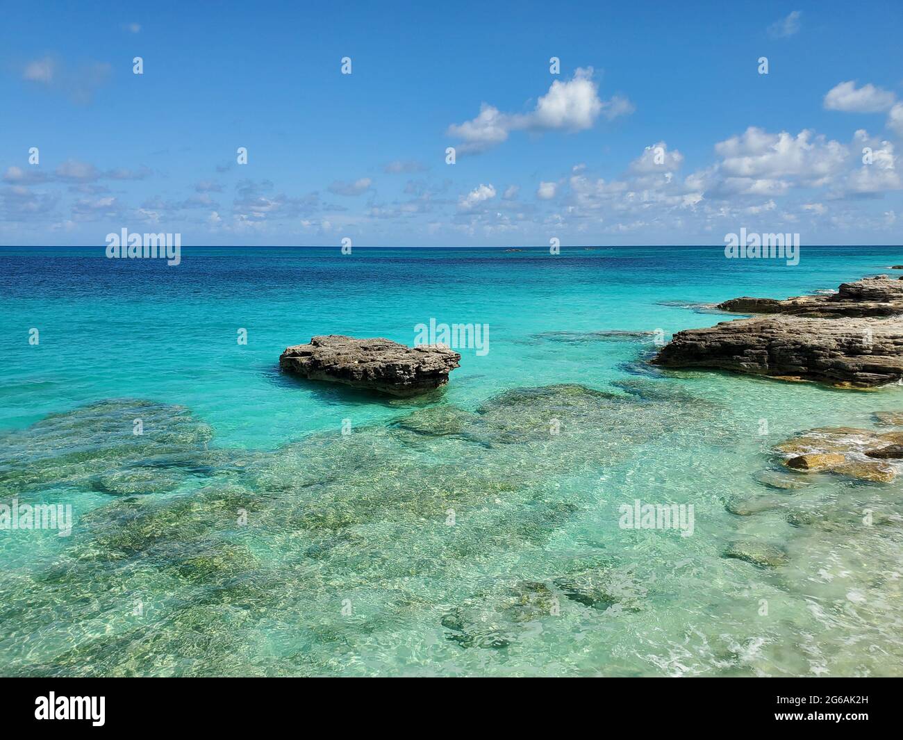 Crystal clear water amidst rocks and sandy beaches of North Bimini's ...