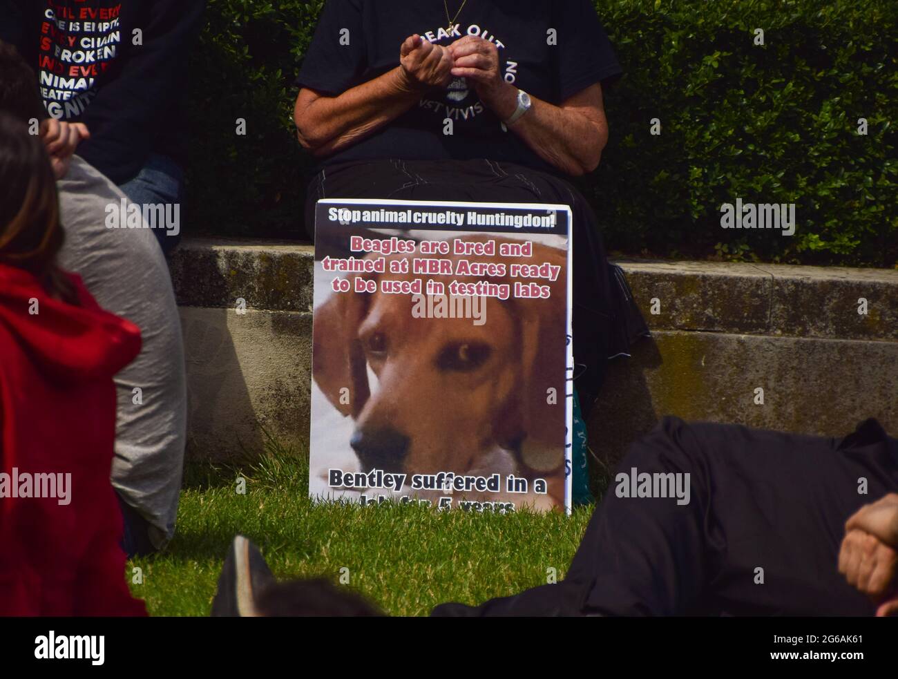 London, UK. 04th July, 2021. An activist holds a placard with ...