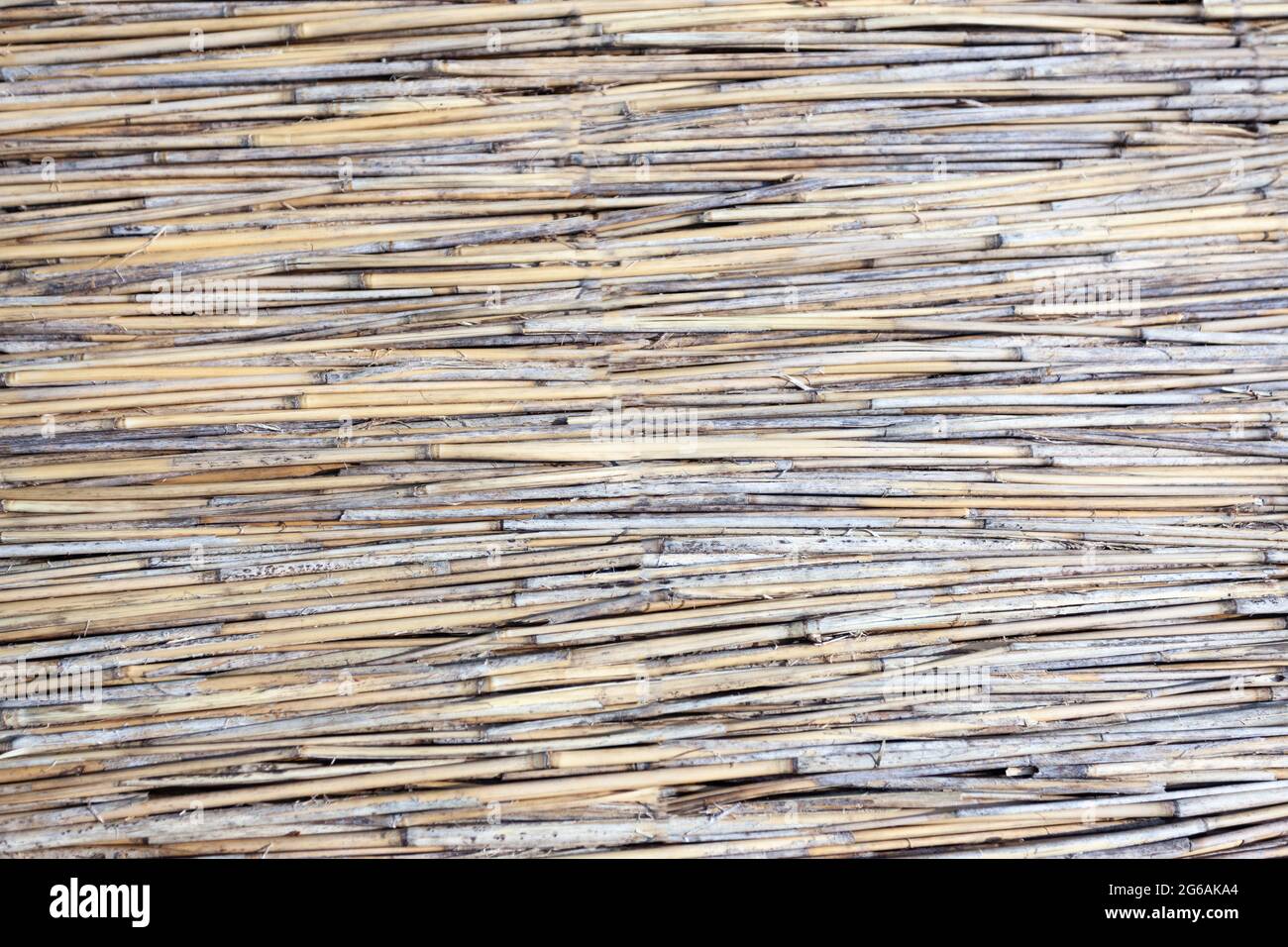 straw fence, dry straw horizontally, background or texture Stock Photo ...