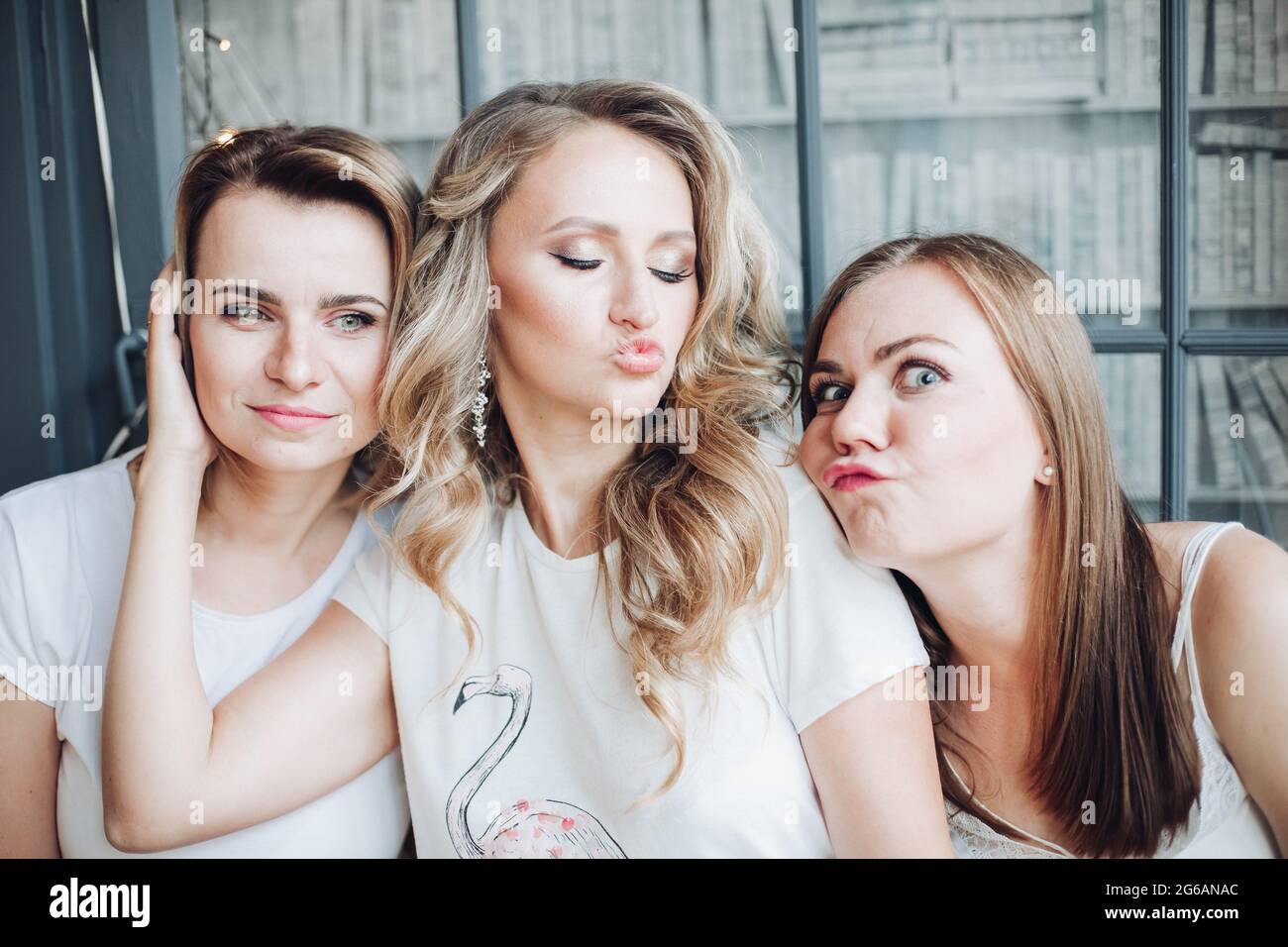 Three best friends rejoices together and hugs each other Stock Photo ...