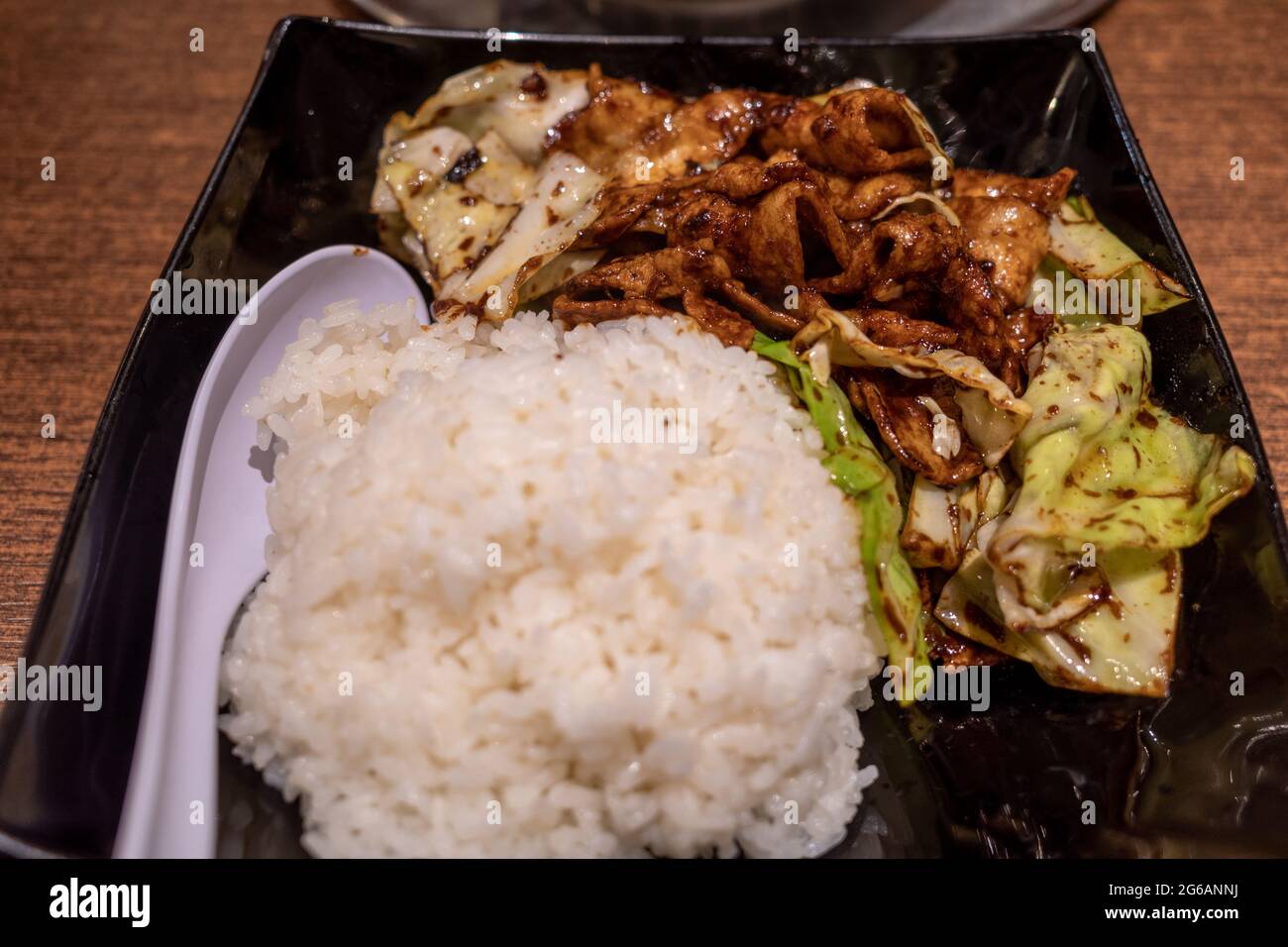 Top view of Buta Don, Rice Bowl with pork, cabbage and sweet spicy miso ...