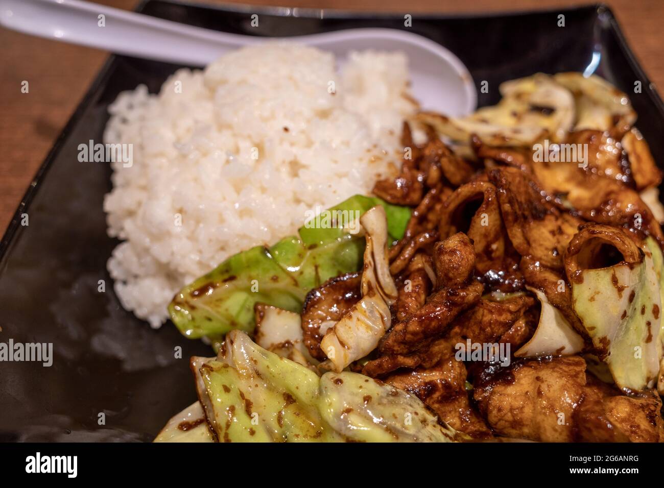 Top view of Buta Don, Rice Bowl with pork, cabbage and sweet spicy miso ...