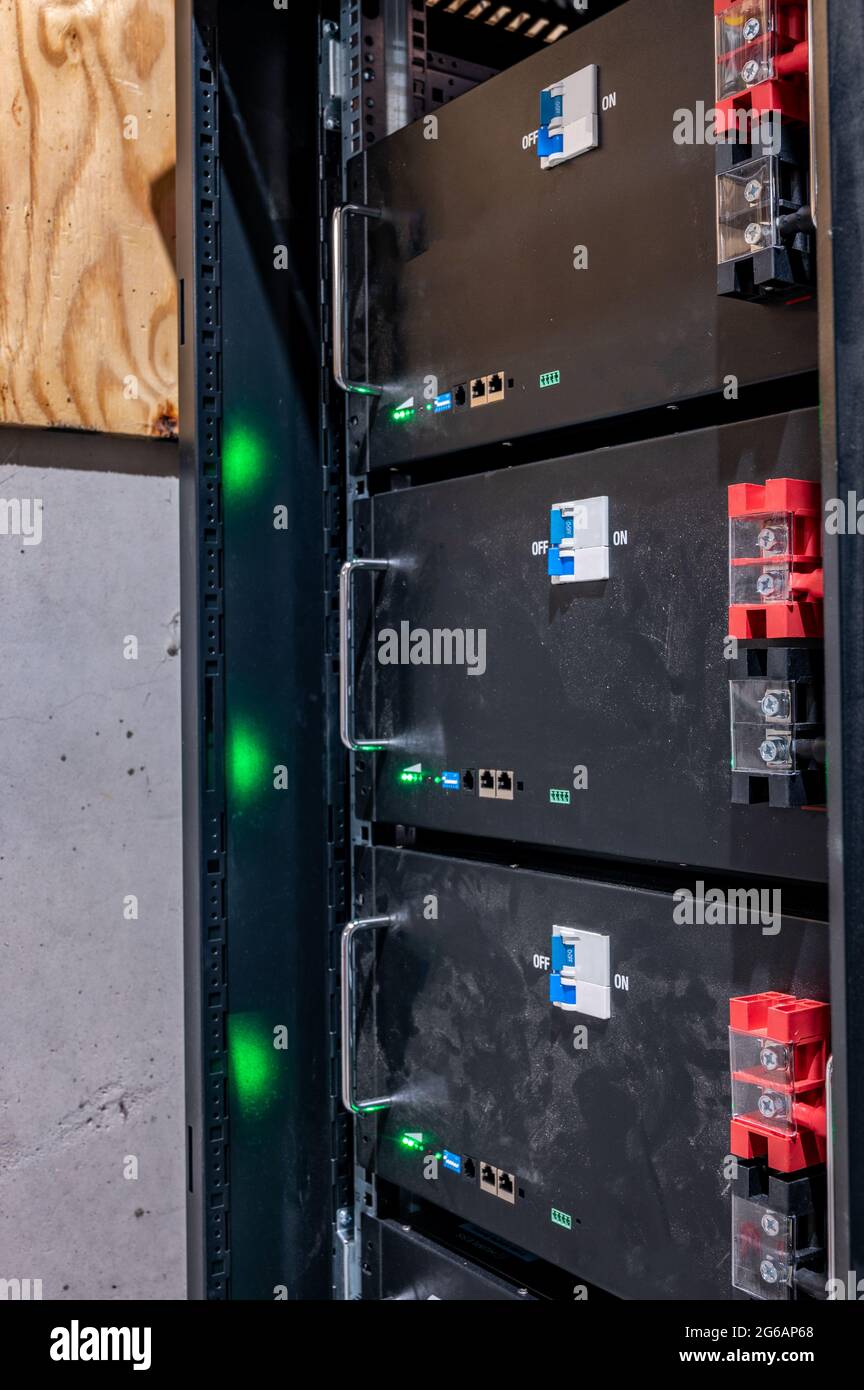 bank of electric batteries in a residential house used for backup power ...