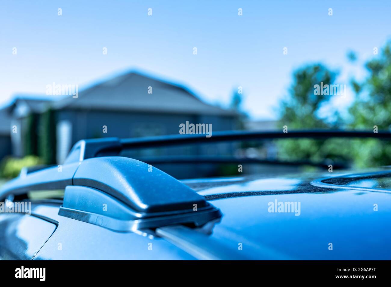 Narrow selective focus on the roof rack with cross bars installed on ...