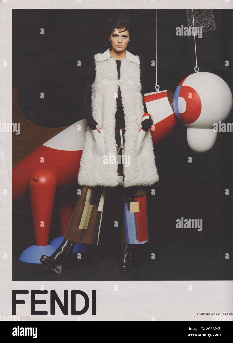 poster advertising FENDI fashion house with Kendall Jenner in paper ...