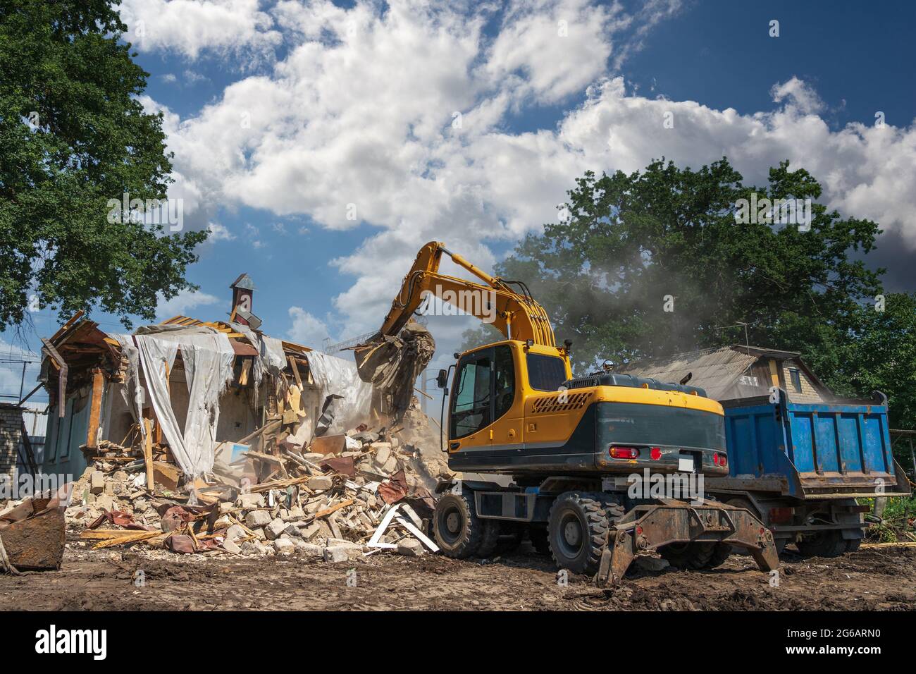 Hydraulic Excavator Breaks House. Building Demolition or Destruction ...