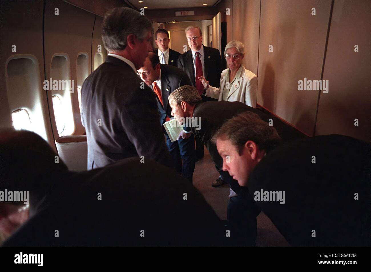 President George W. Bush and his staff look out the windows of Air ...