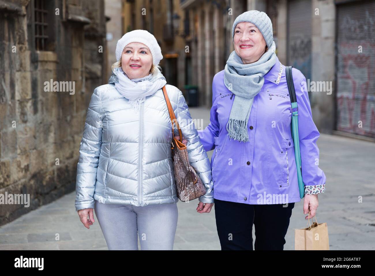 Elderly women walking around town Stock Photo - Alamy