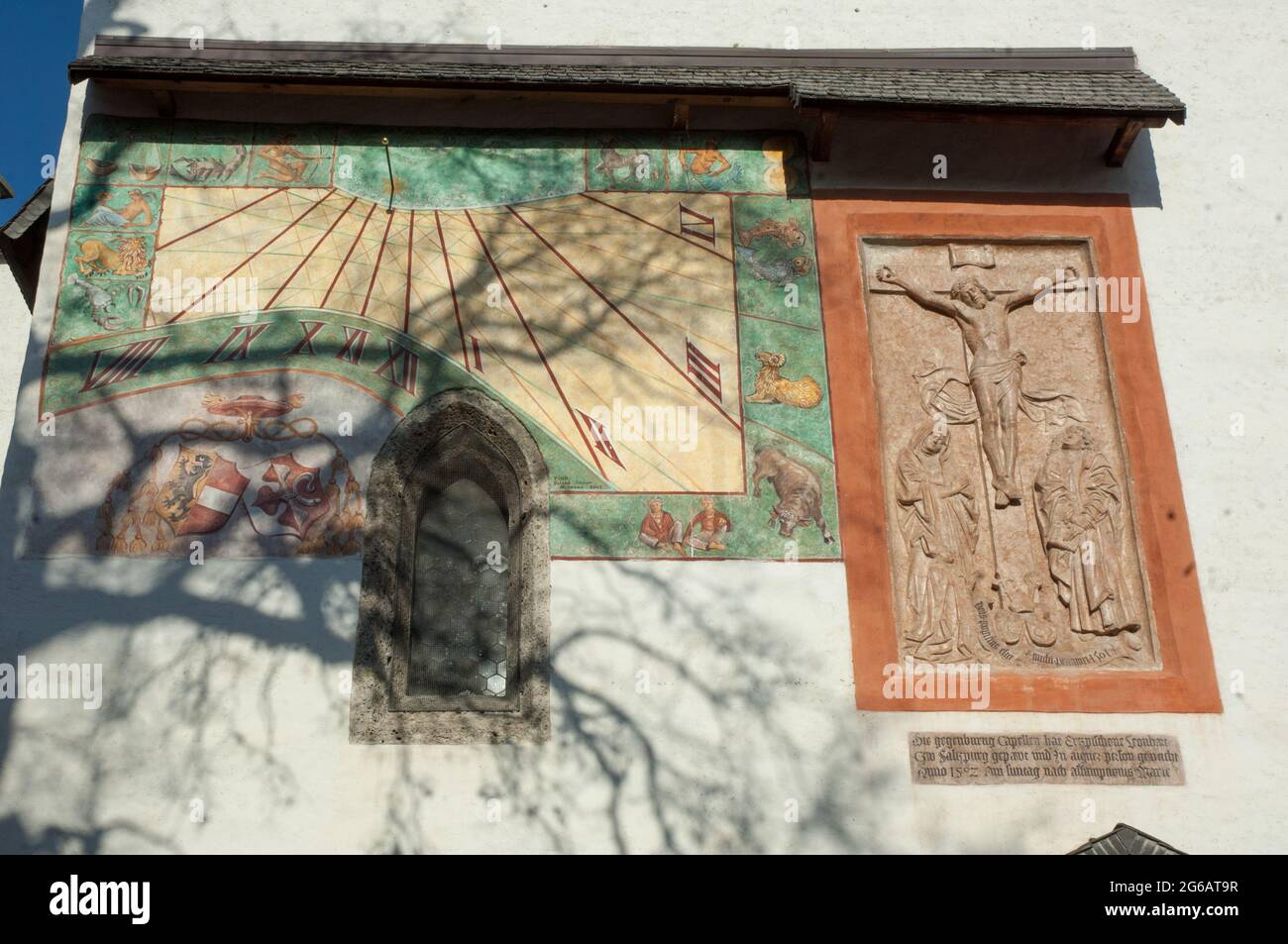 Sundial, crucified Christ, chapel of St. George Stock Photo - Alamy