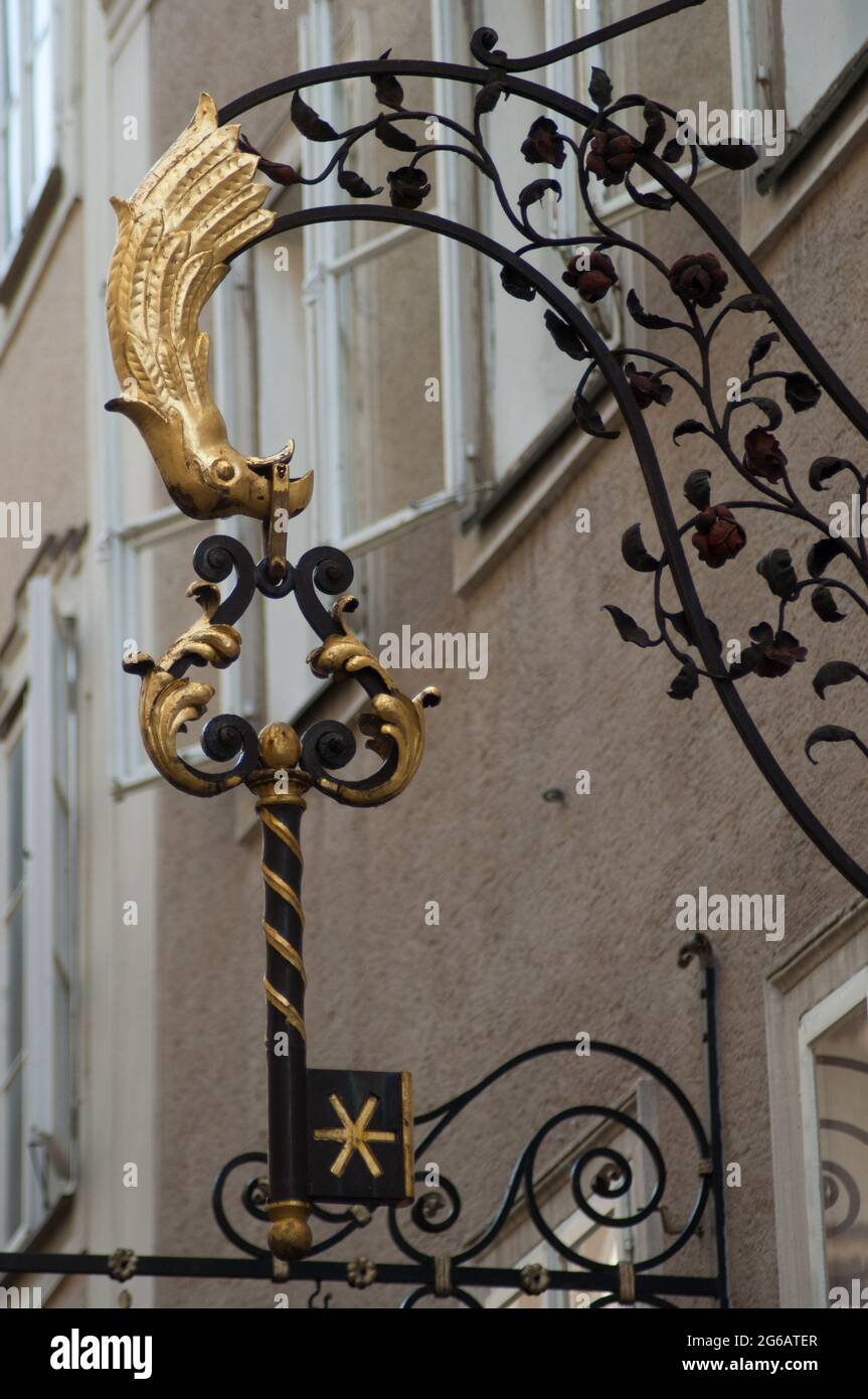 Blacksmith advertisement on the Getreidegasse Stock Photo - Alamy