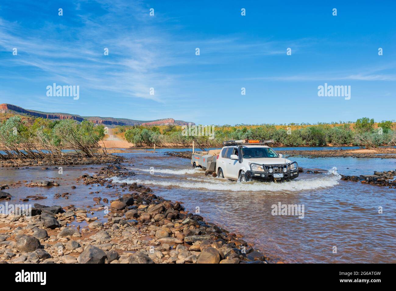 Off-road car towing a trailer crossing the iconic Pentecost Crossing ...