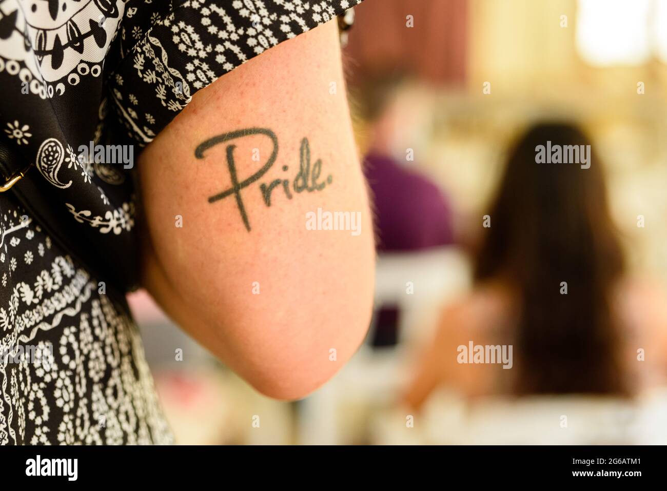 Detail of the arm of a participant in the gay pride festival, with the ...