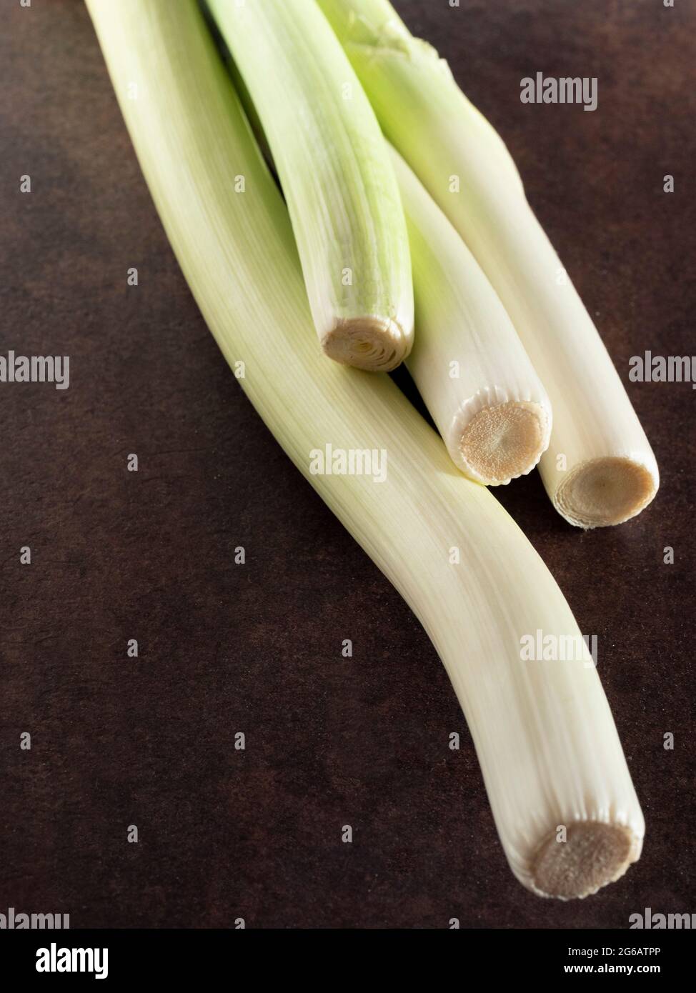 Bunch of clean leeks on wood Stock Photo - Alamy