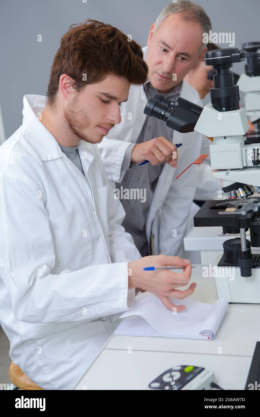 student documenting his observation Stock Photo - Alamy