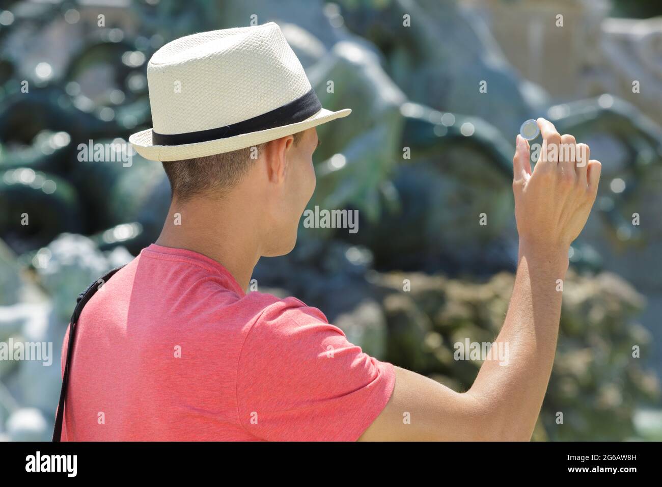 People throwing coins into fountain hi-res stock photography and images ...