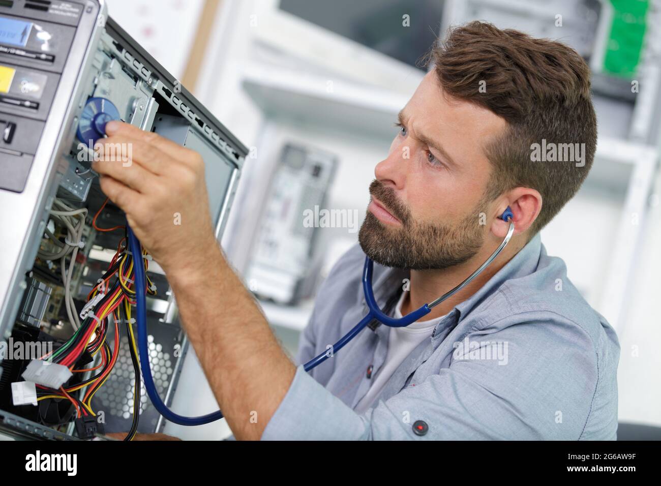man is repairing a computer Stock Photo - Alamy