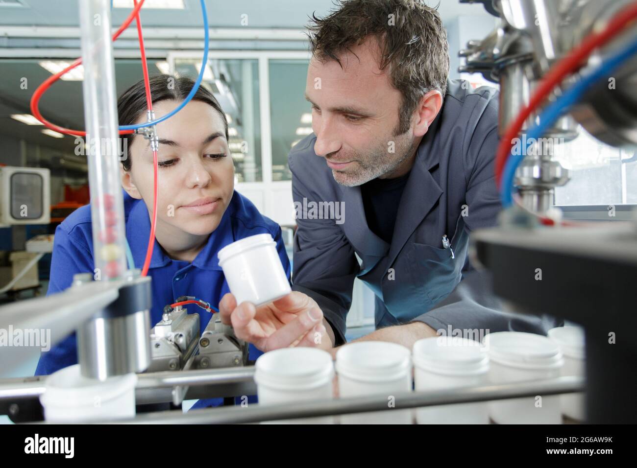 manager controlling employees during work in production centre Stock ...