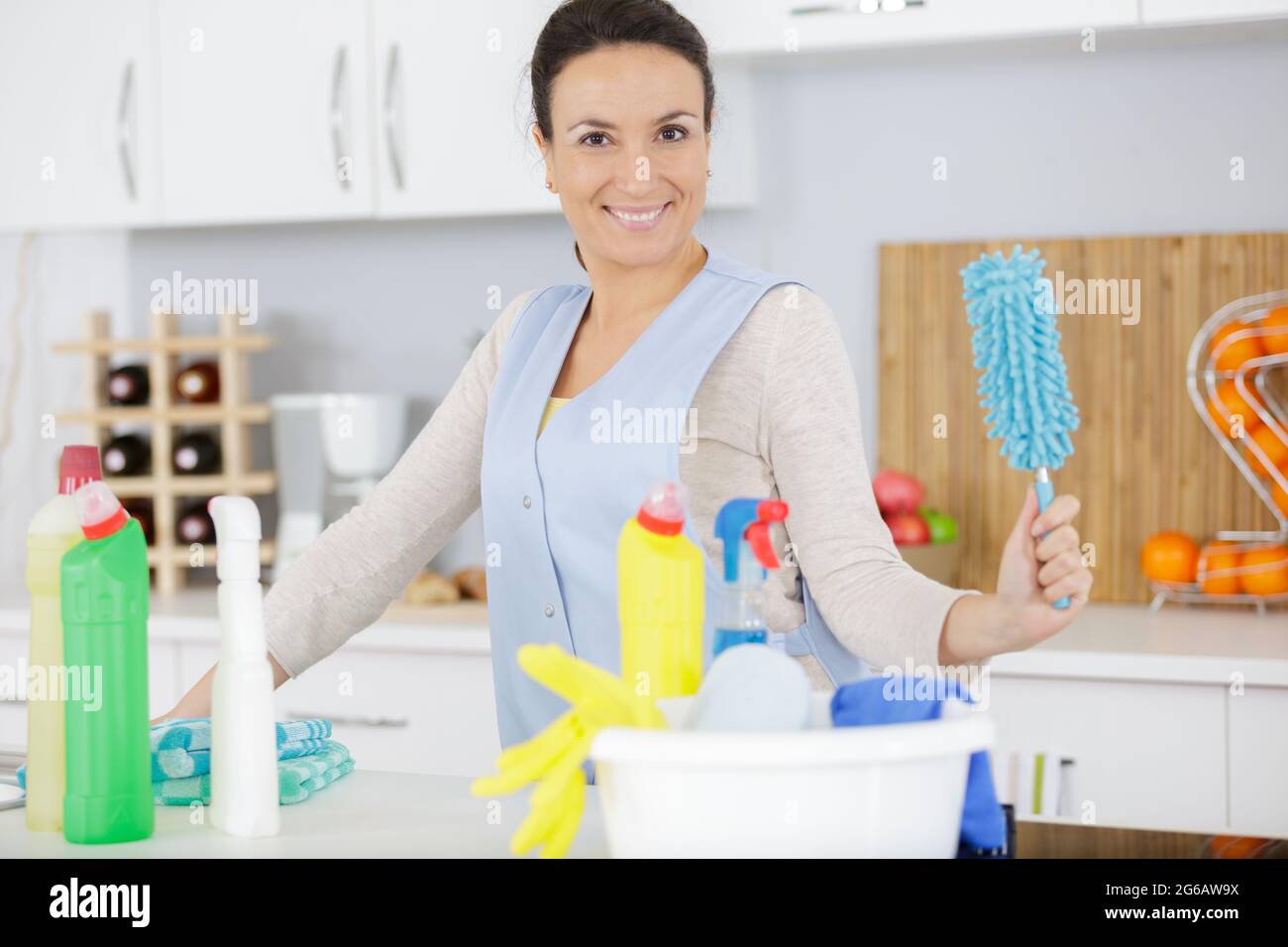 happy cleaner girl with chestnut hair working Stock Photo - Alamy