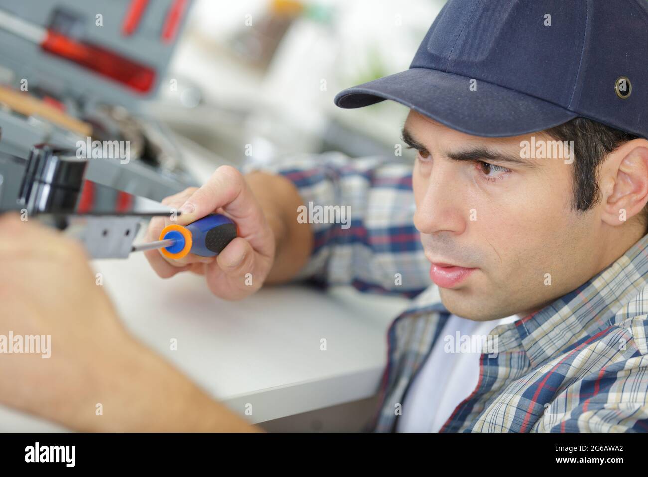 concentrated man working on an electrical installation Stock Photo - Alamy