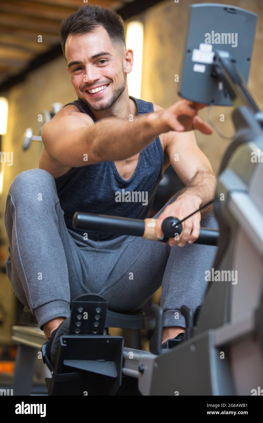 Man on rower machine hi-res stock photography and images - Alamy