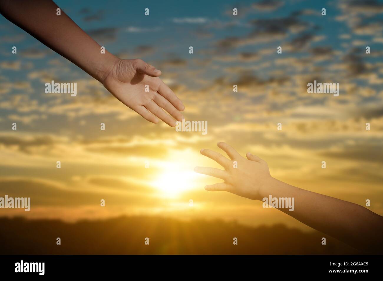 Climber giving hand helping friend hi-res stock photography and images ...