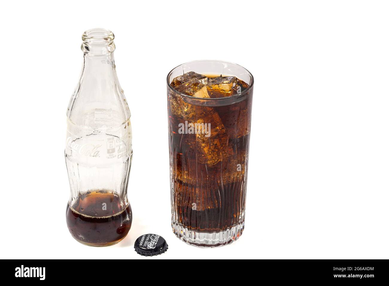 Close up view of Coca Cola poured into a glass with ice cubes Stock ...