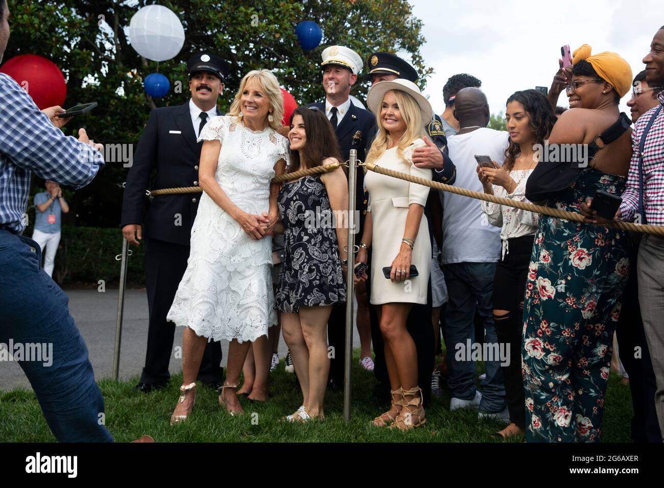 US First Lady Jill Biden (L) poses for a picture with people on the ...