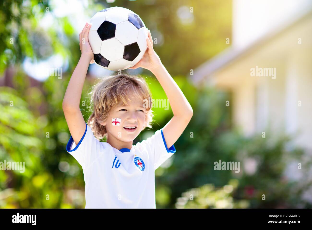 England football fan cheering. Kids play soccer and celebrate victory ...