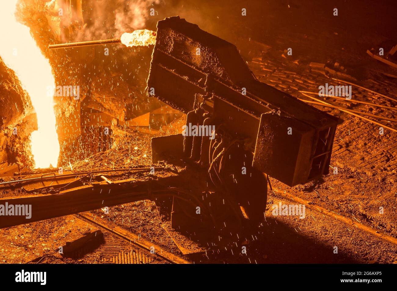 process of taking a sample of liquid metal in a steelmaking furnace ...