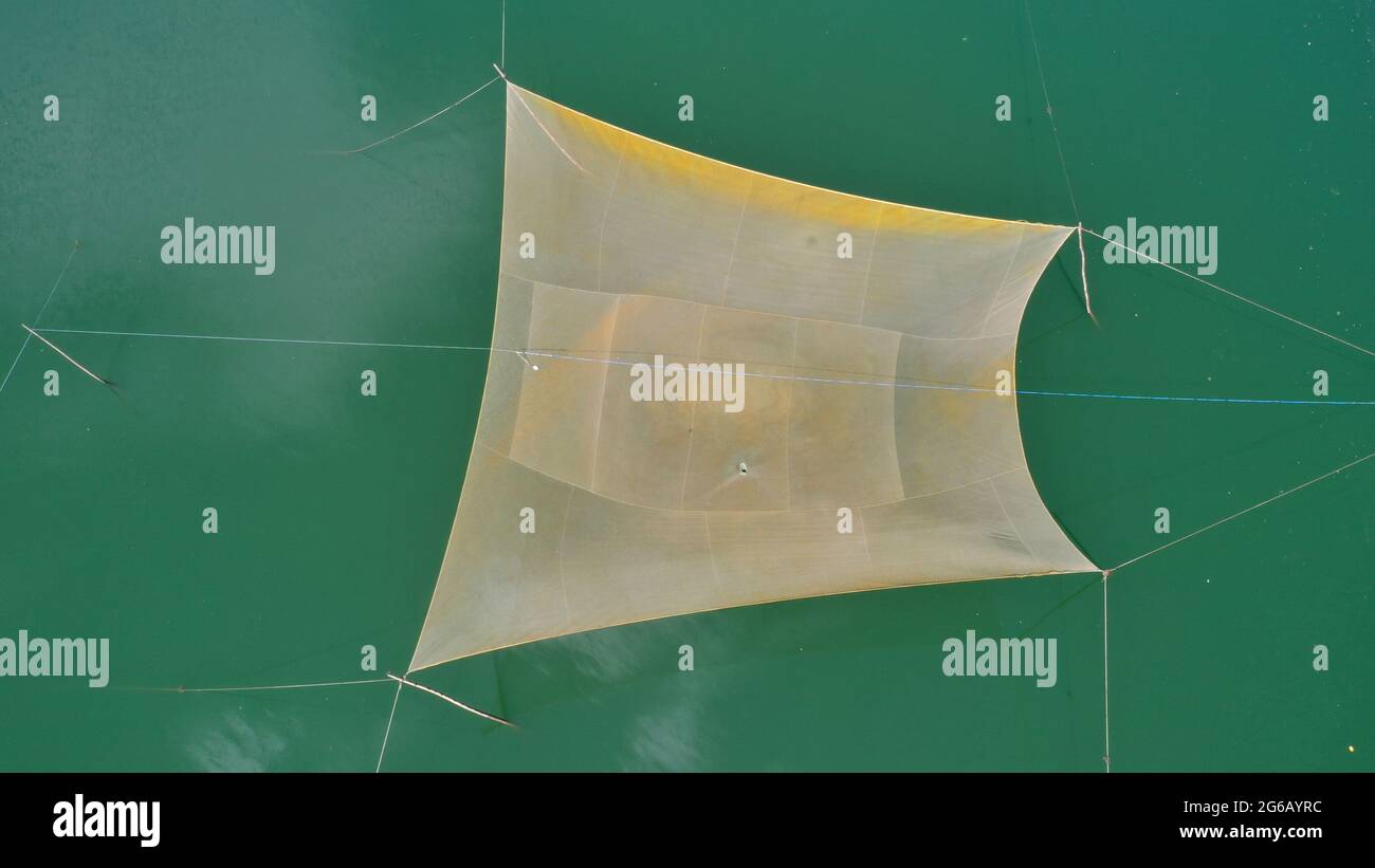 Yellow fishing net on the river central Vietnam Stock Photo - Alamy