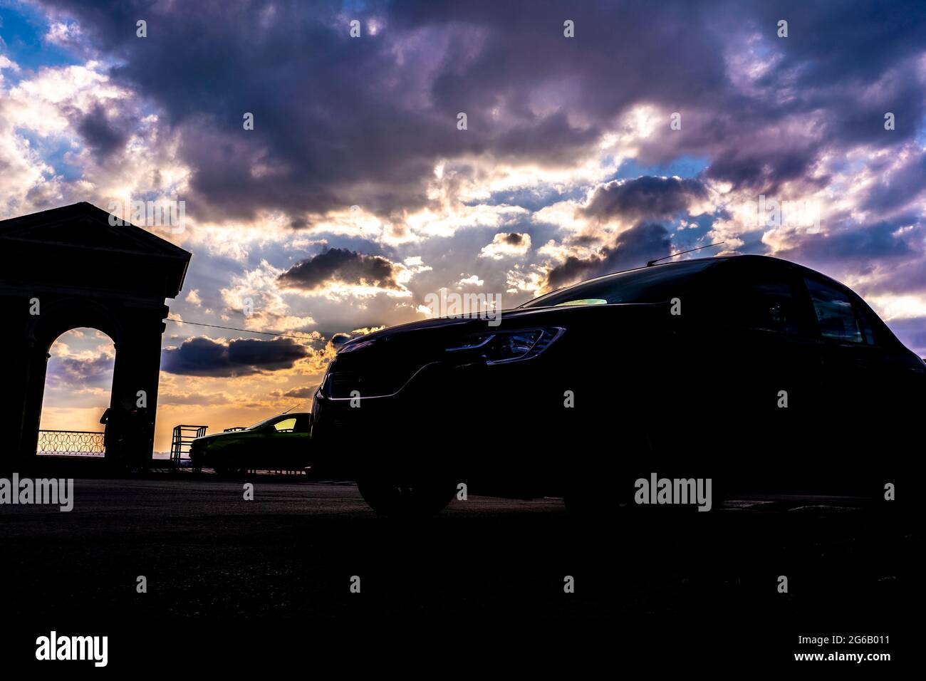 car silhouette on evening sky during the sunset Stock Photo - Alamy