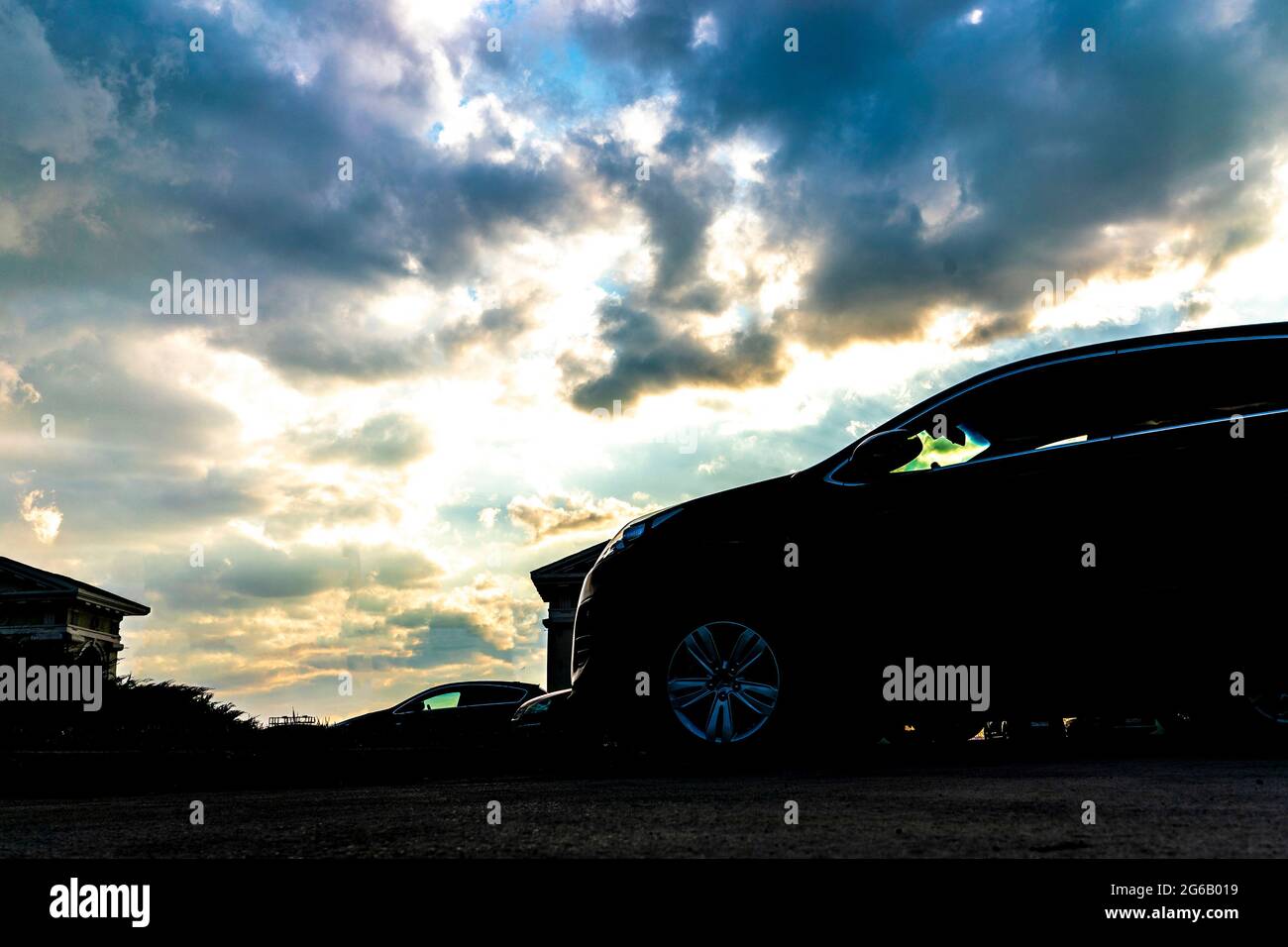 car silhouette on evening sky during the sunset Stock Photo - Alamy