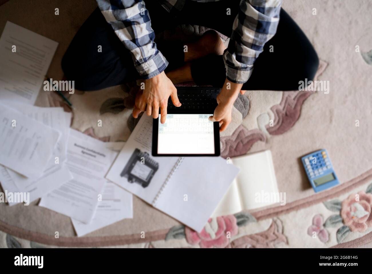 Happy young woman sitting floor laptop making hi-res stock photography ...