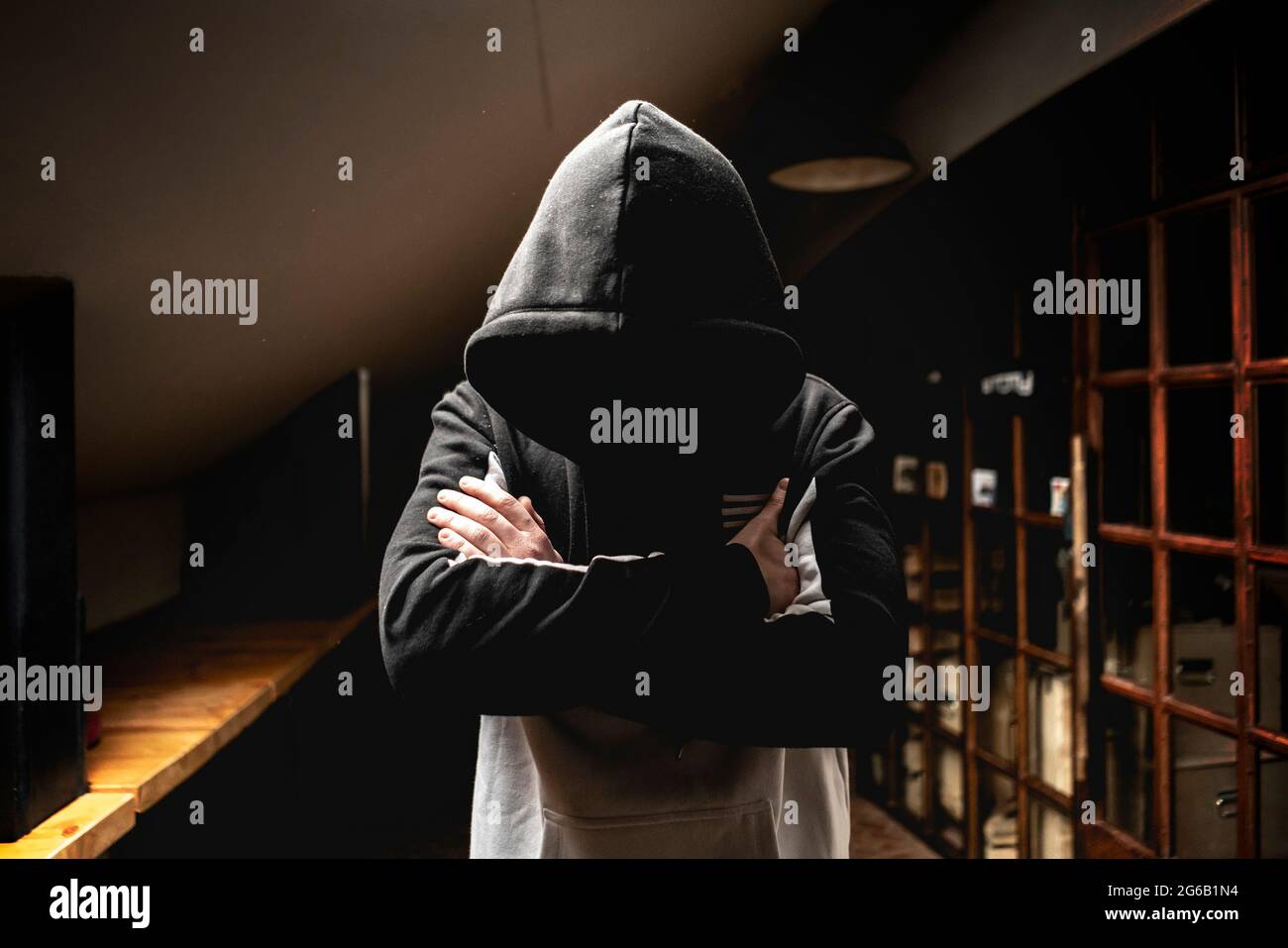 anonymous man in the dark hood standing in the mysterious pose Stock ...