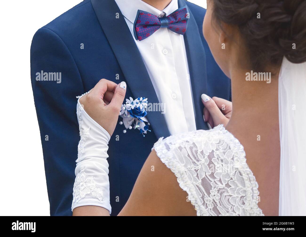 The bride and groom's hug at the wedding. A man in a blue suit and ...