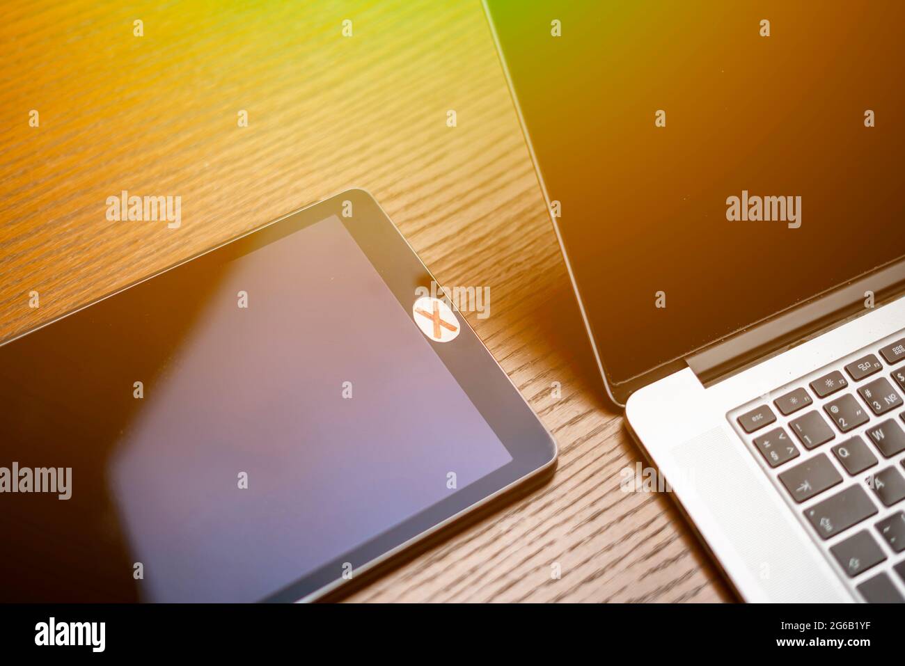 close up gadget with front camera taped on wooden table Stock Photo - Alamy