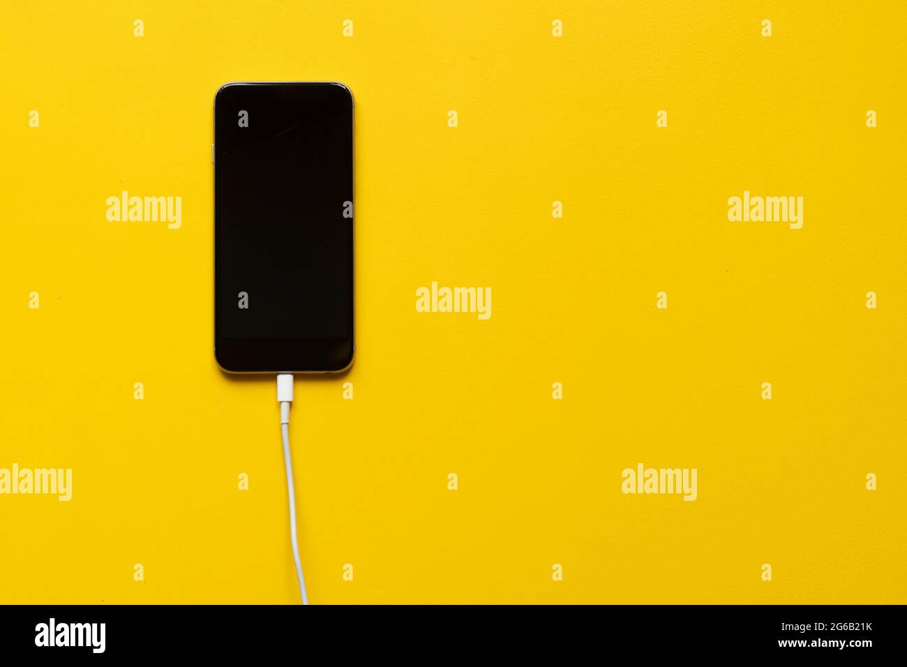 charging wire inserted in smartphone isolated Stock Photo - Alamy