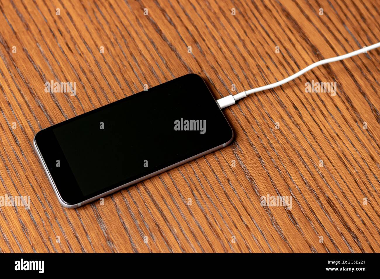 charging wire inserted in smartphone isolated Stock Photo - Alamy