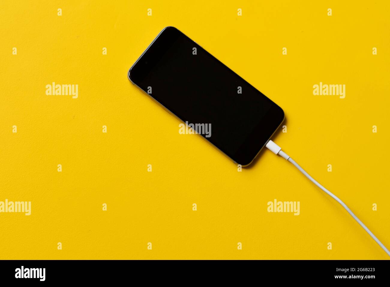 charging wire inserted in smartphone isolated Stock Photo - Alamy