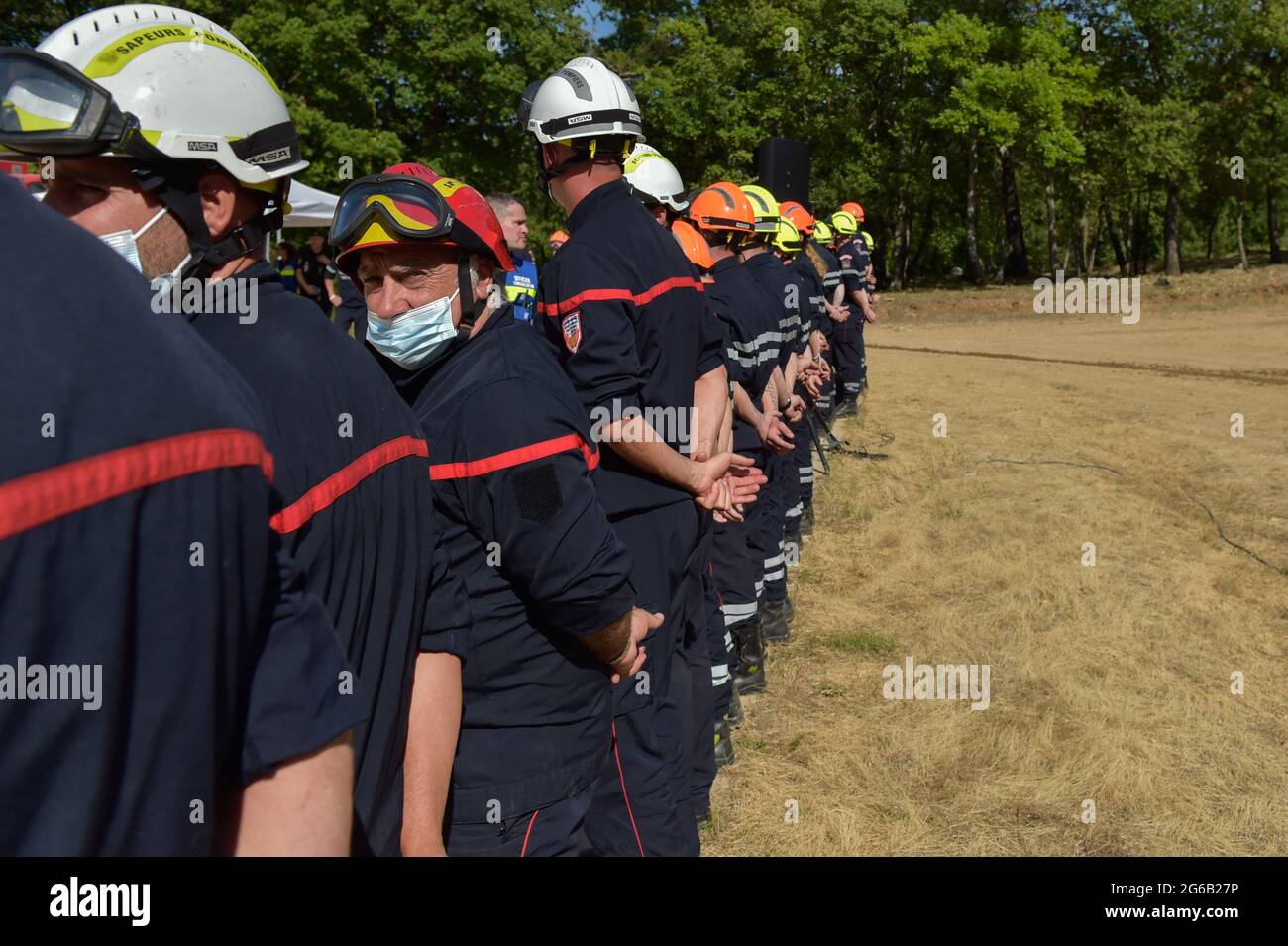 A group of firefighters are seen in a line during the final training ...