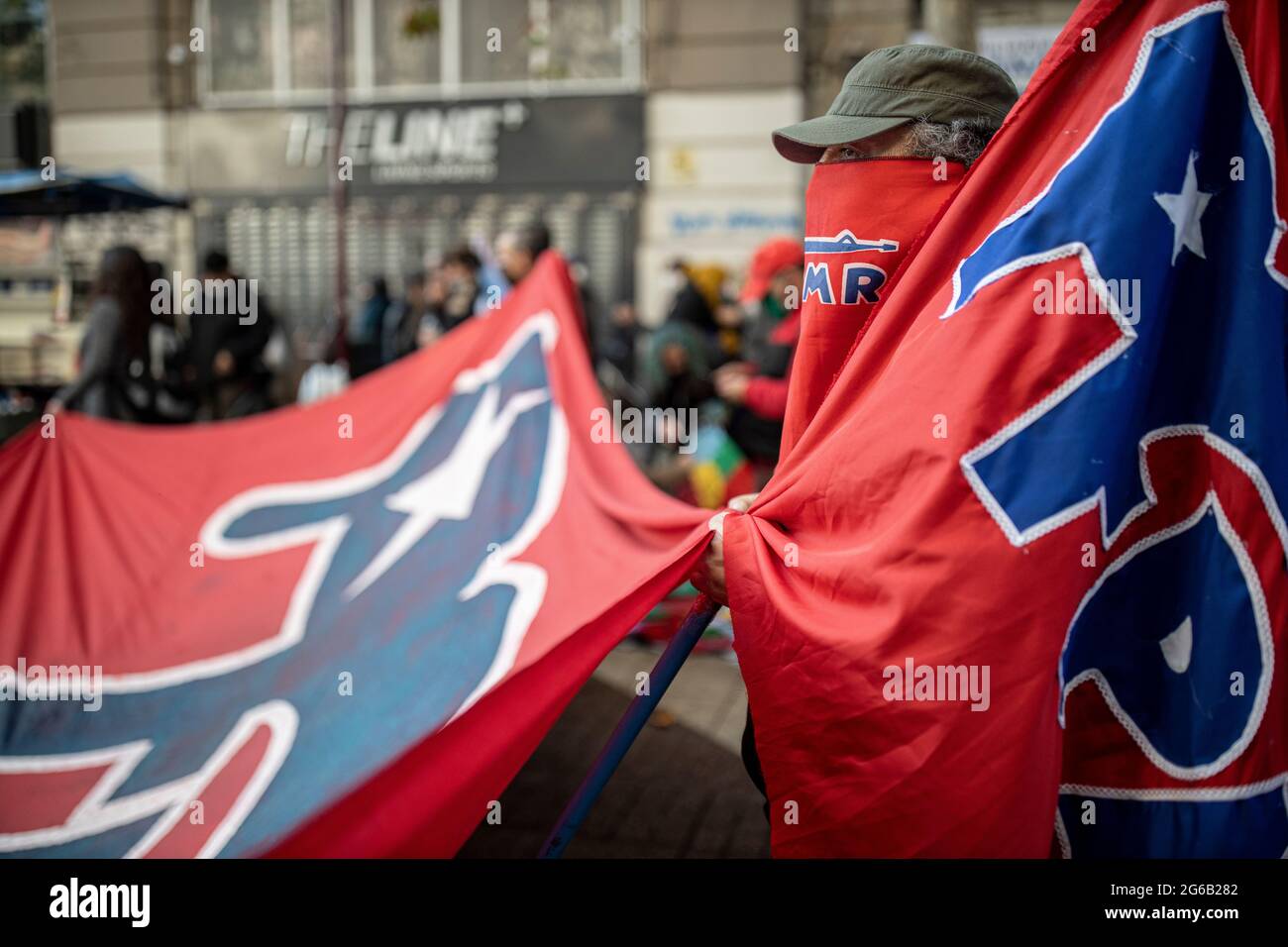 Protesters hold a flag during the demonstration.Protesters gathered ...