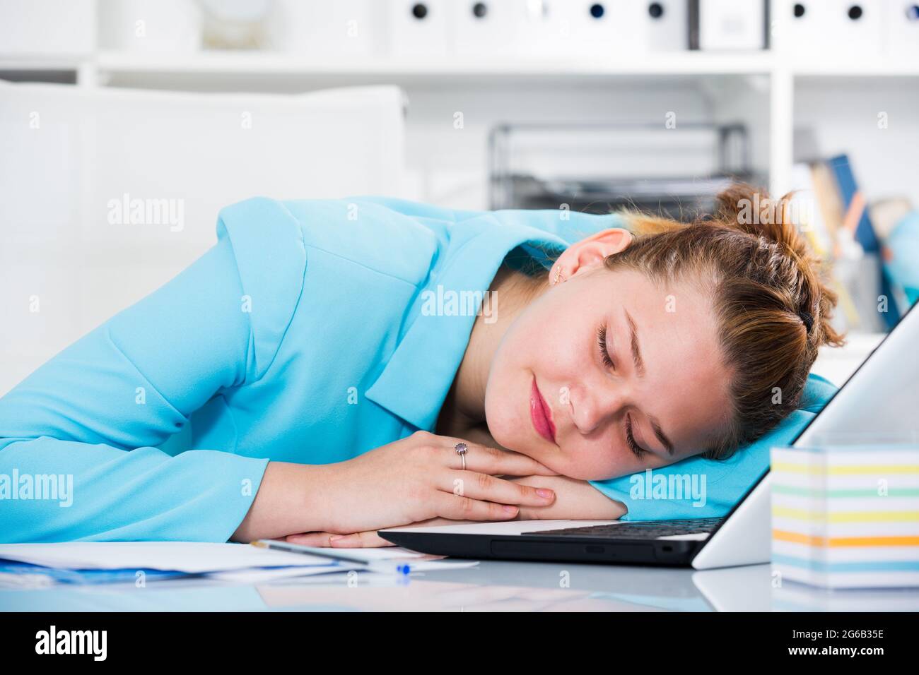 Woman worker is sleeping at work after putting the reports Stock Photo ...