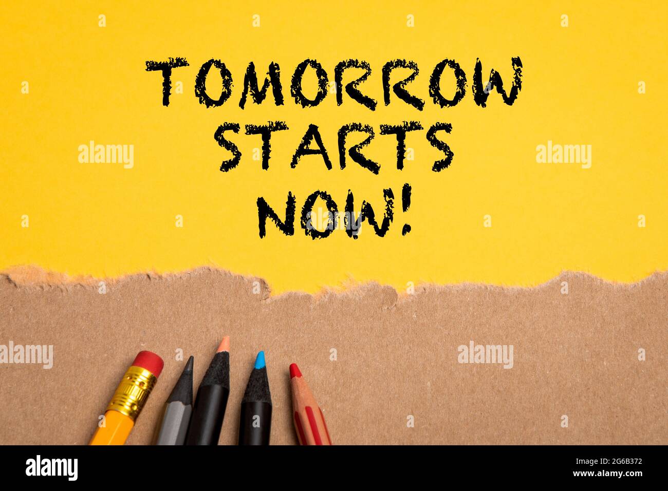 Tomorrow starts now. Colored pencils on a cardboard and yellow ...